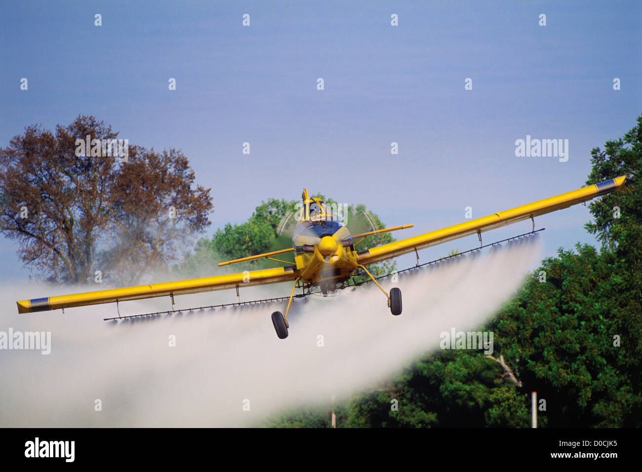 Crop Duster Zooms Above a Tomato Field Leaving Fertilizer in its Wake ...