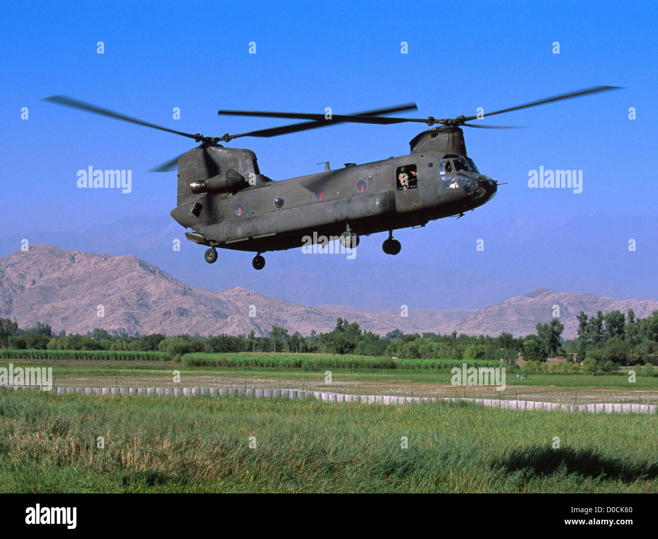 A CH-47 Chinook Heavy Lift Helicopter Approaches A Landing Strip In ...