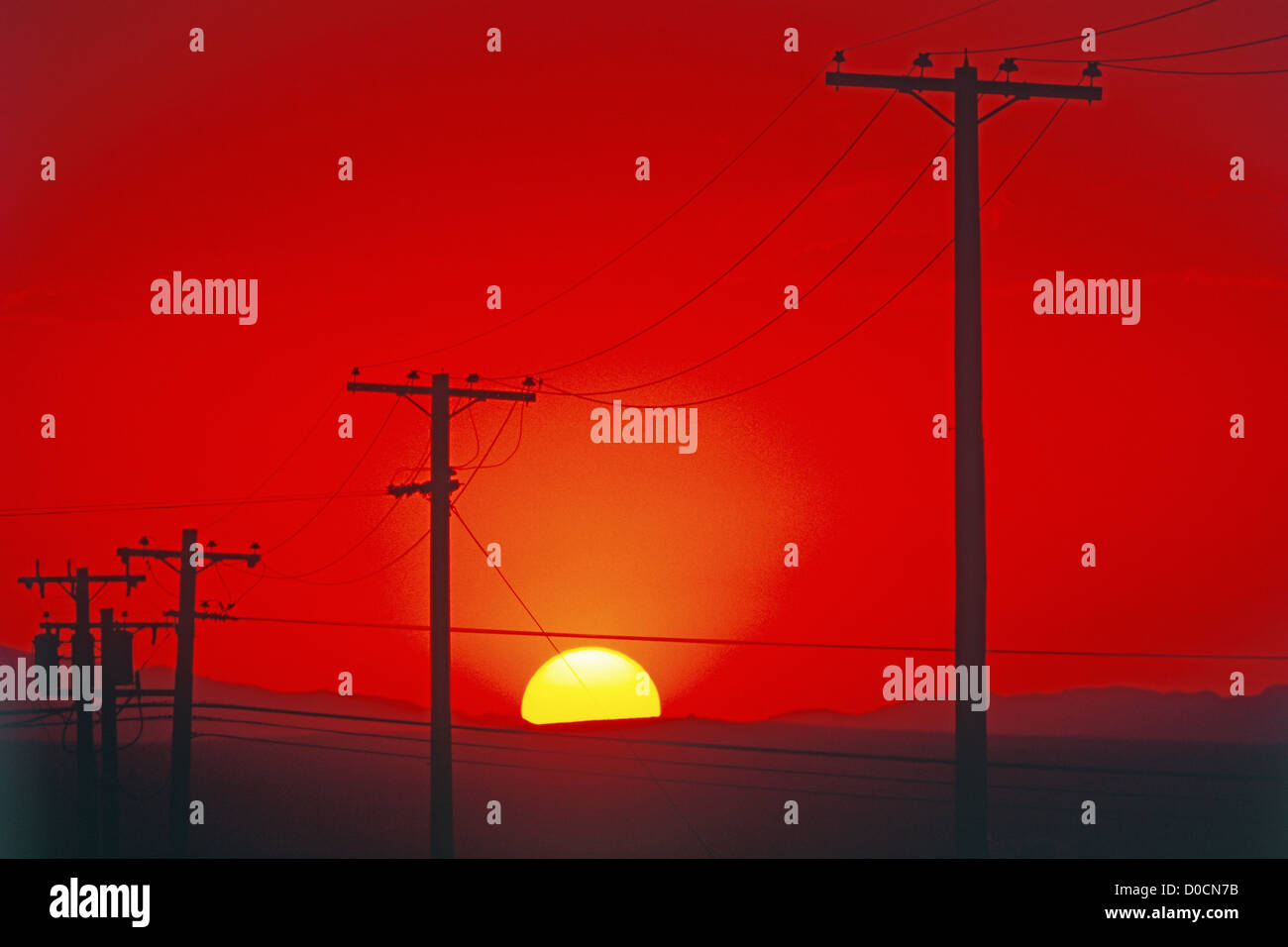 A July Sunset Silhouettes Power Lines in the Southern California Desert ...