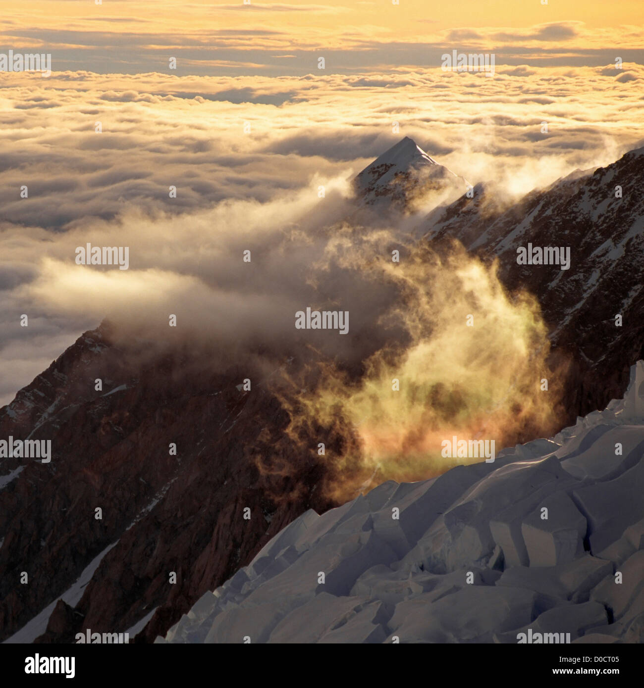 A Lone Cloud Floats High Above a Large Cloud Deck Amid the Ridges of ...