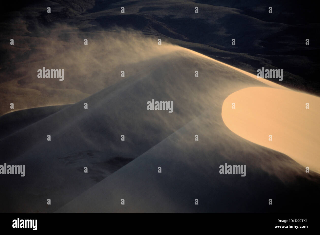 Wind Lifts Streamers of Sand Off The Crest of a Dune Field Stock Photo ...