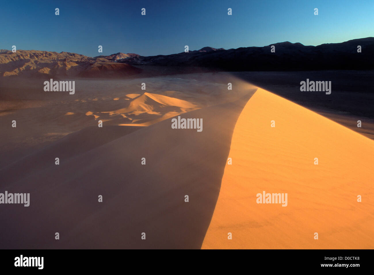 Wind Lifts Streamers of Sand Off the Crest of a Dune Field Stock Photo ...