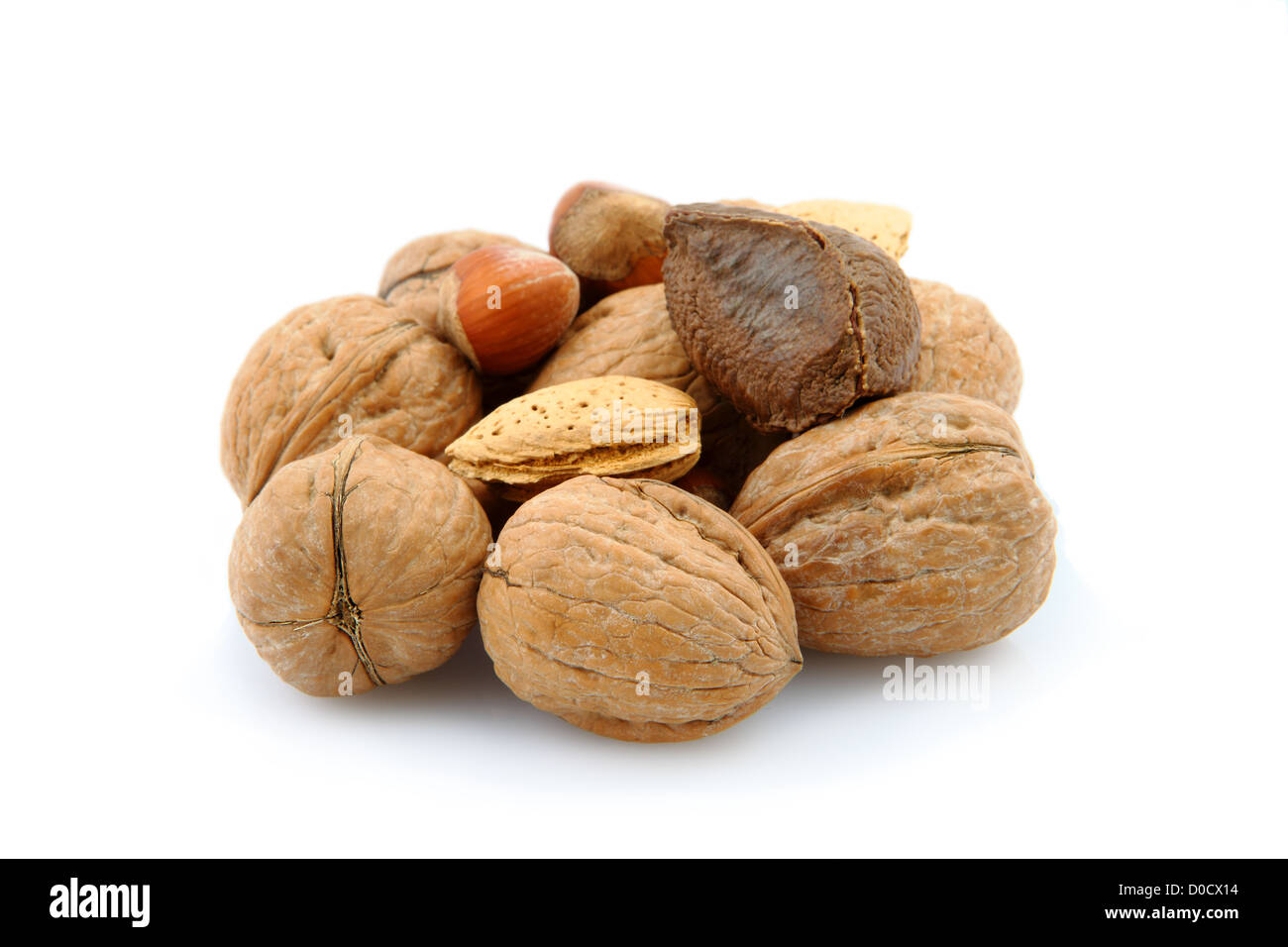 Mixed nuts on white background with almonds, hazelnuts, and walnuts ...