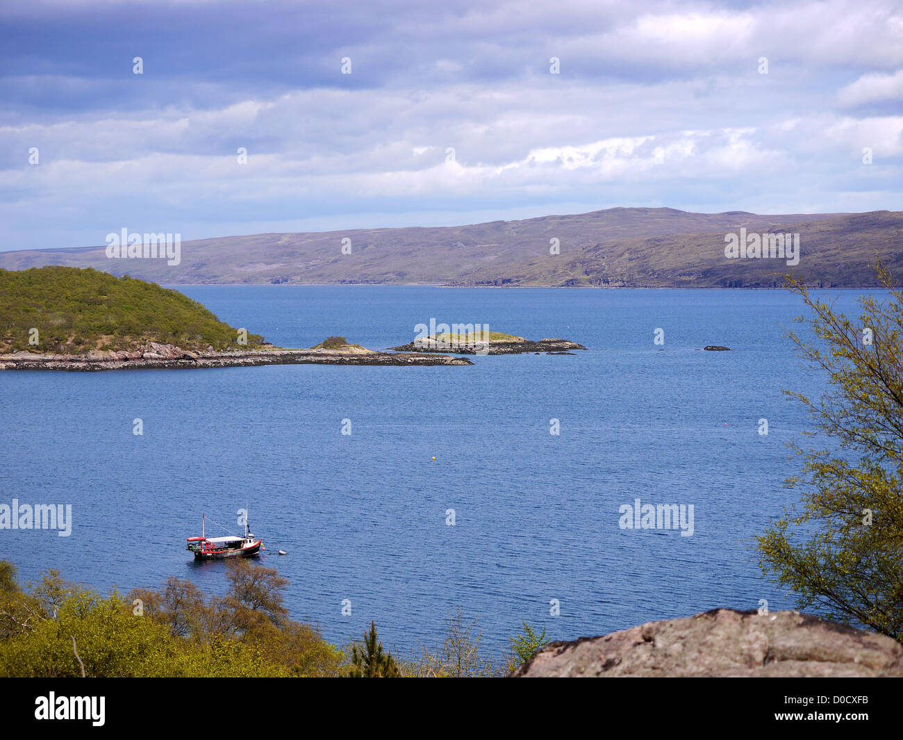 Small boat moored in Loch Torridon on the Applecross Peninsula close to ...
