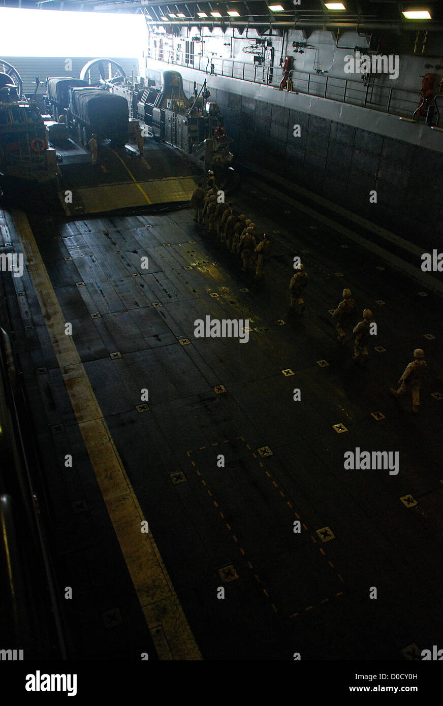 Marines board a landing craft, air cushion (LCAC) aboard the USS Green ...