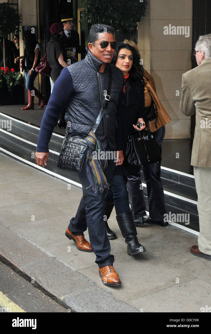 Jermaine Jackson and wife Halima Rashid leaving their hotel and walking ...
