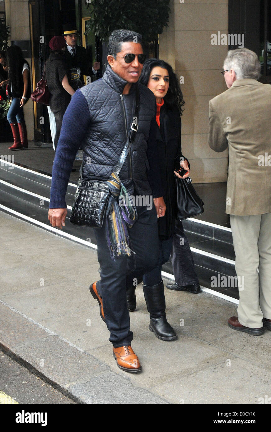 Jermaine Jackson and wife Halima Rashid leaving their hotel and walking ...