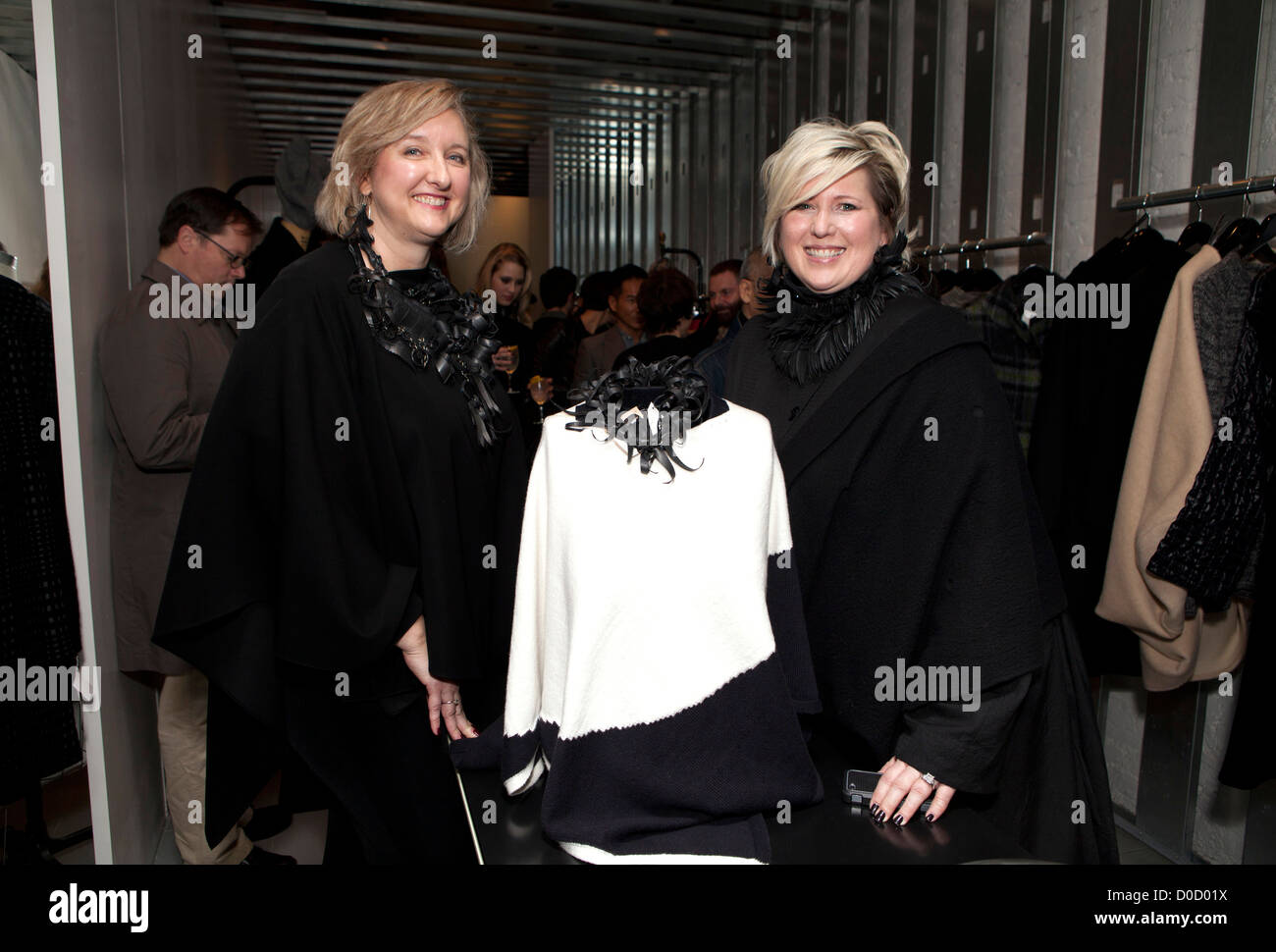Margaret Nowak Dobos and Kathleen Nowak Tucci Yeohlee opens the garment ...
