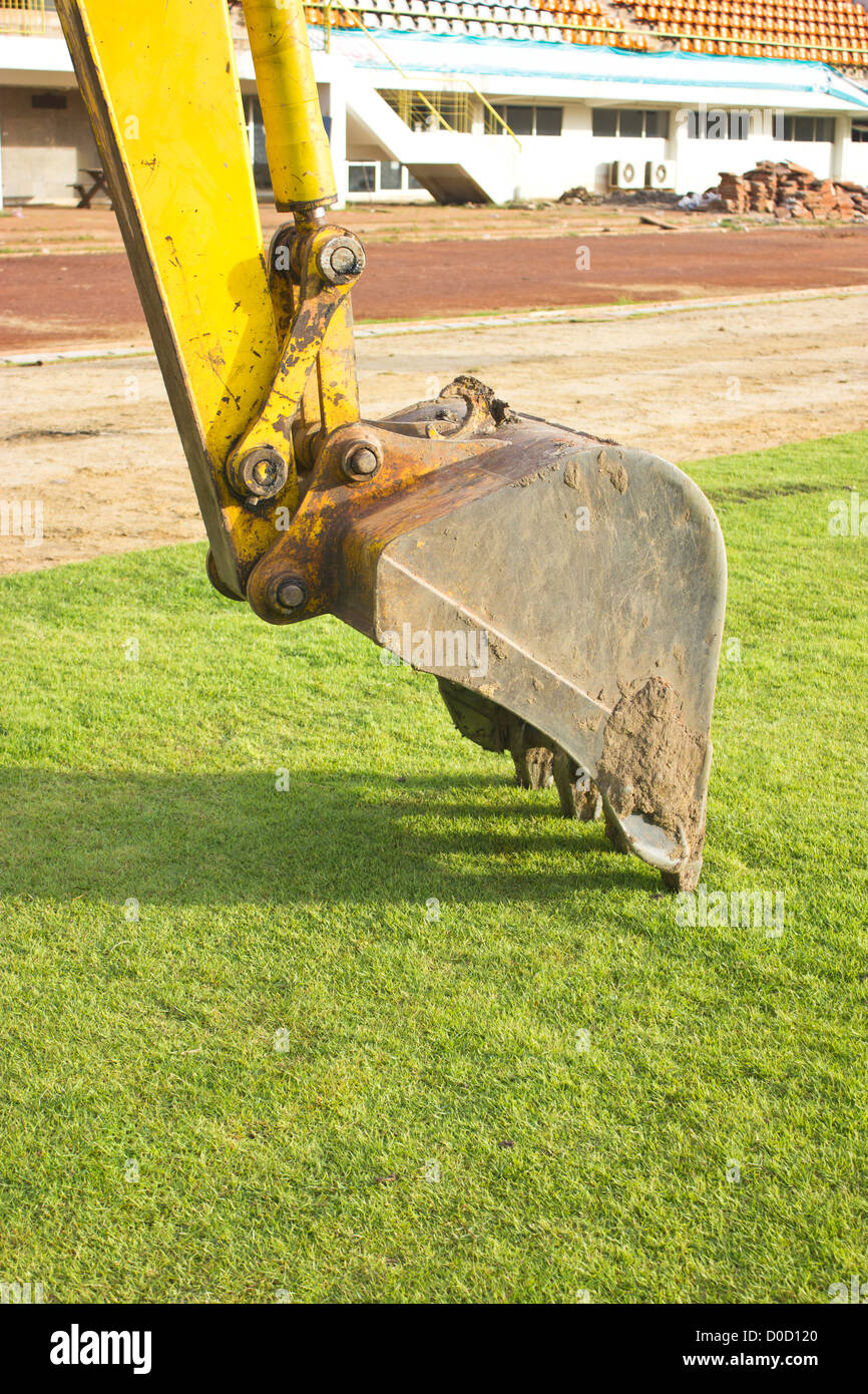 A huge shovel digging on ground Stock Photo - Alamy