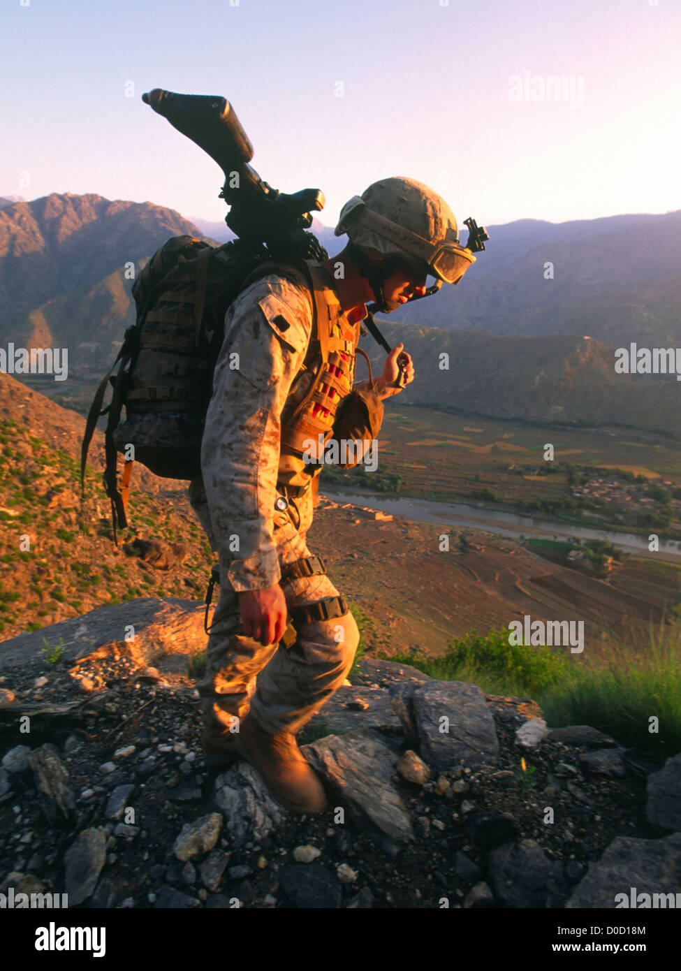 A US Marine Light Machine Gunner Ascends a Steep Mountainside During a ...