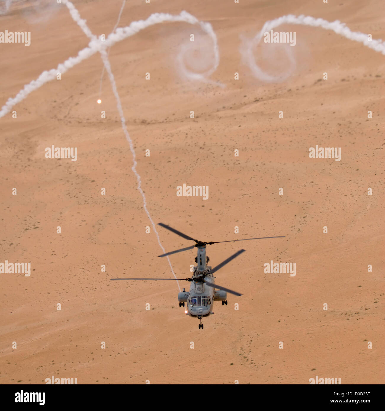 A US Marine Corps CH-46 Sea Knight Flies Through Smoke Expended Flares Used Counter Anti ...