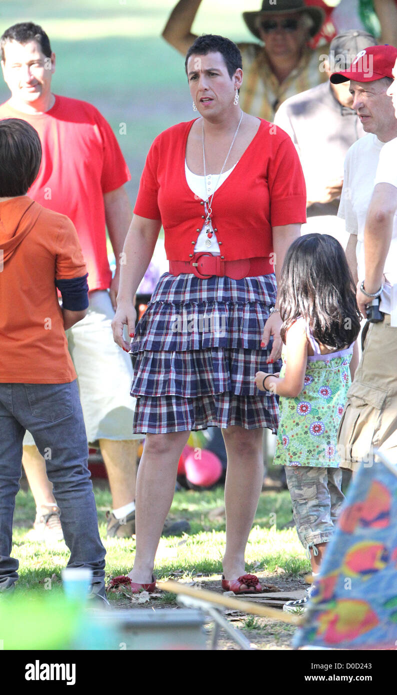 Adam Sandler dressed as a woman in a red cardigan and skirt, on the ...