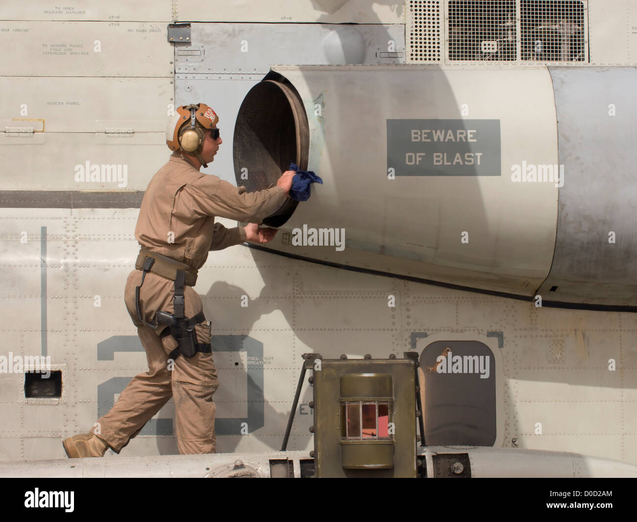 A US Marine Crew Chief Inspects Exhaust Jet Engine CH-53D Sea Stallion ...