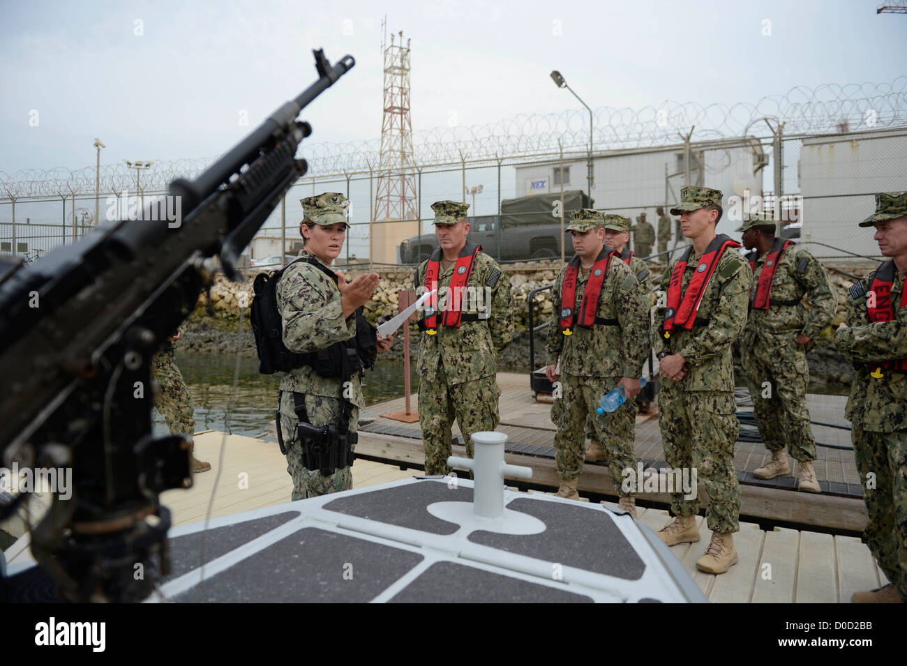 Master-at-Arms 3rd Class Andrea Bryant gives a safety brief to MCPON ...