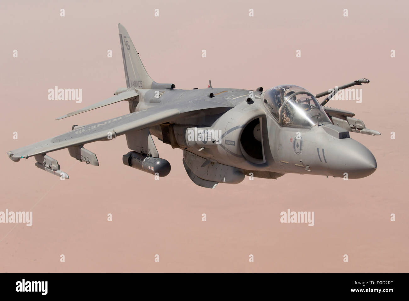 A US Marine Corps AV-8B Harrier Prepares to Refuel in Flight Above the ...