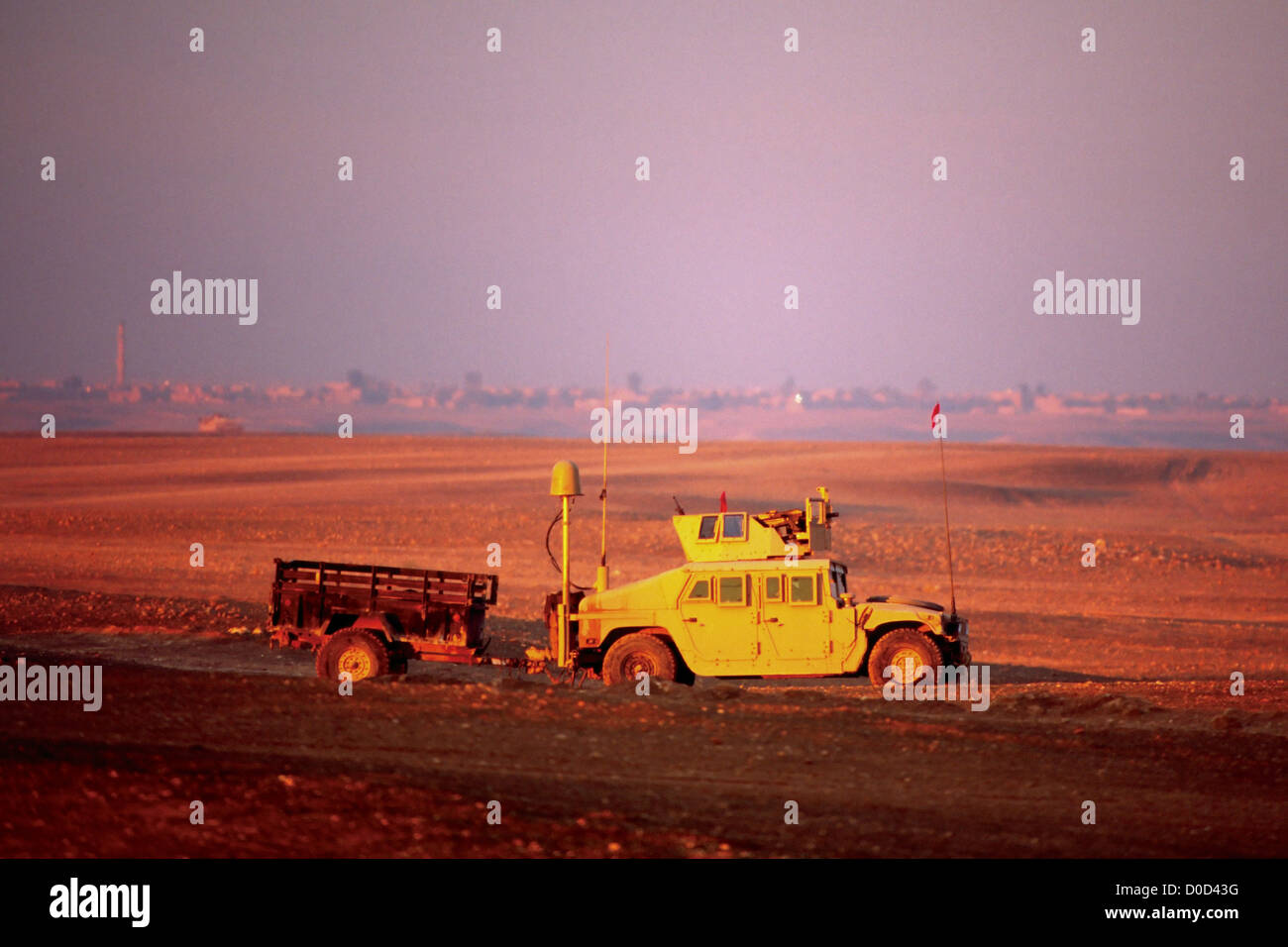 Winter Sunset Light Illuminates a US Marine Corps Humvee During a ...