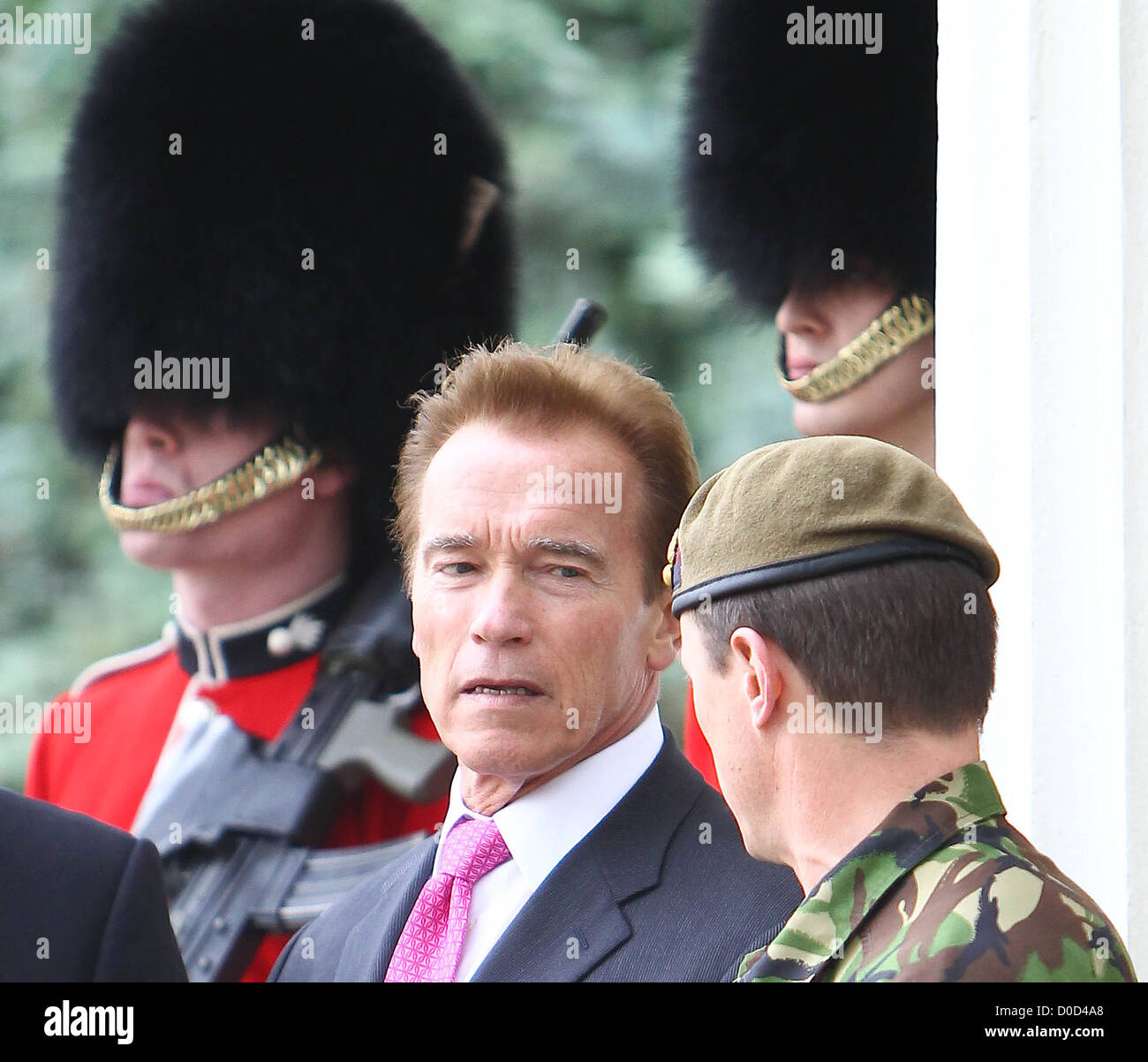 Arnold Schwarzenegger watches the changing of the guards with Prime ...