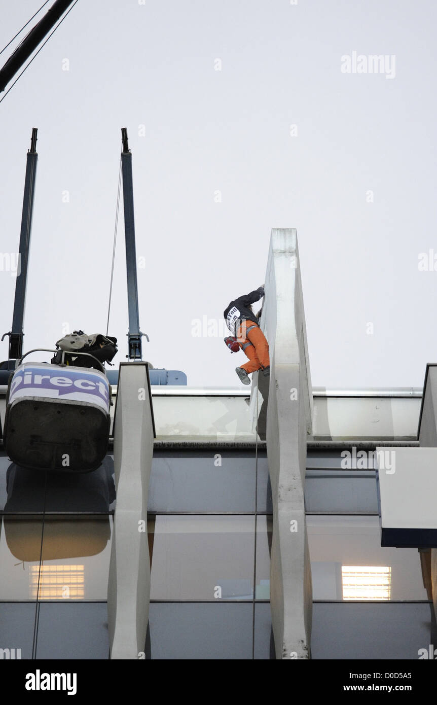 Alain Robert aka "The French Spiderman" climbs the Bollore Direct 8 ...