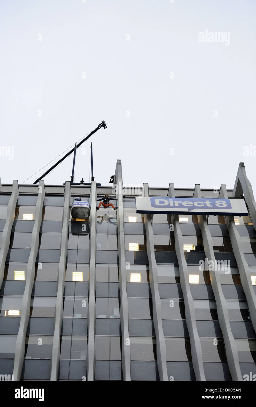 Alain Robert aka "The French Spiderman" climbs the Bollore Direct 8 ...