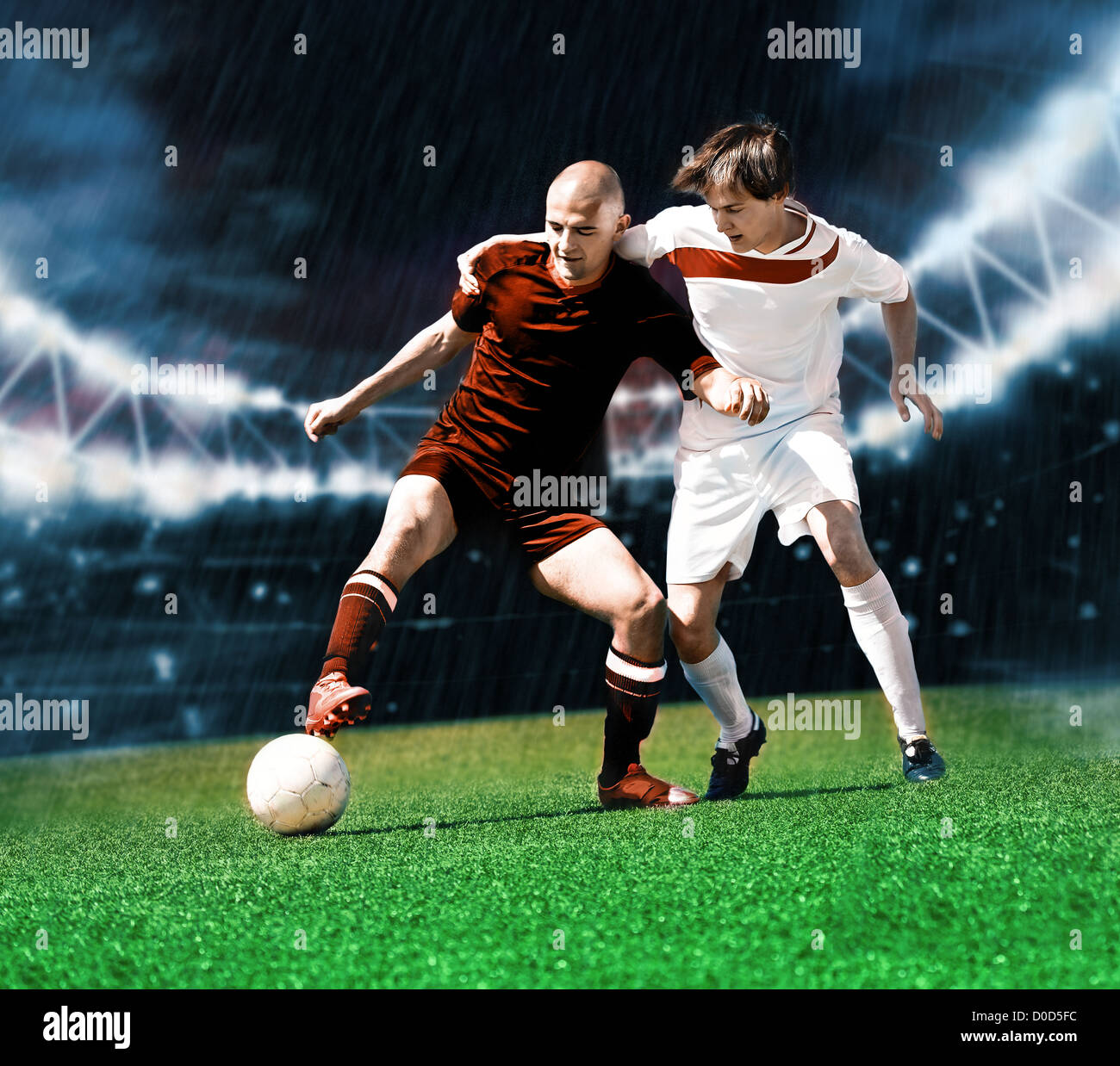 two football players from opposing team on the field Stock Photo - Alamy
