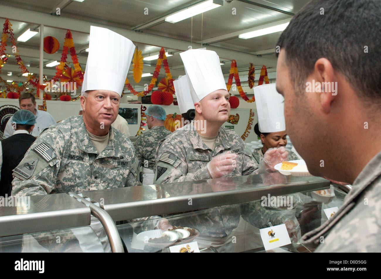 Brigadier General Bud R. Jameson Jr. serves Thanksgiving dinner to a ...