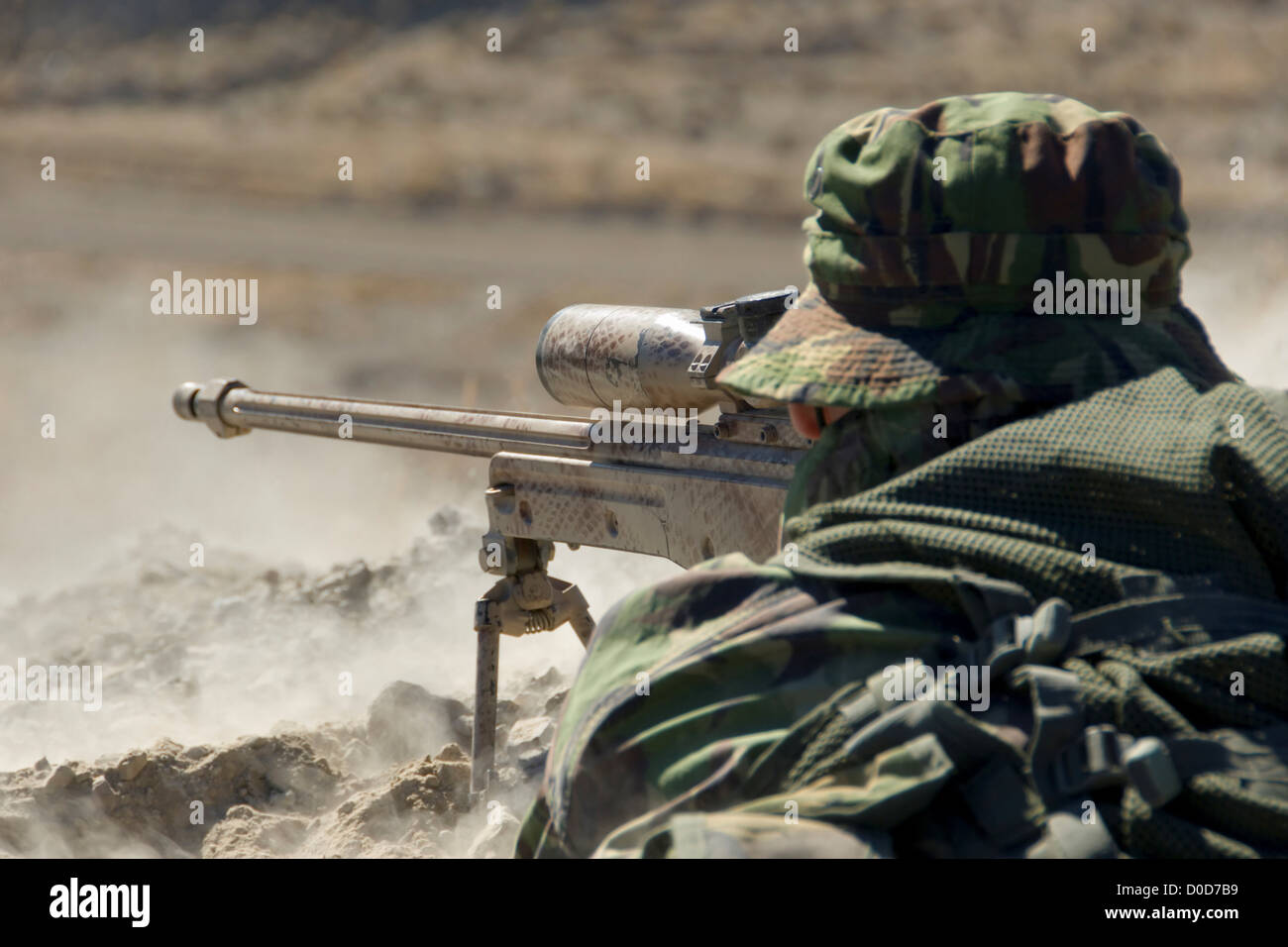 A British Royal Marine Commando Sniper Fires A High Power Rifle Stock ...