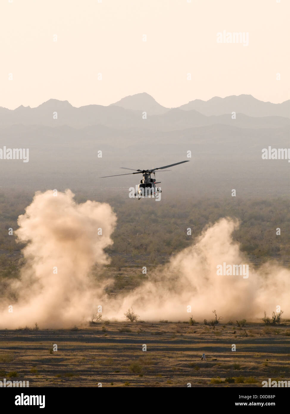UH-1Y Attack Helicopter Flies Through Dust and Smoke Stock Photo - Alamy