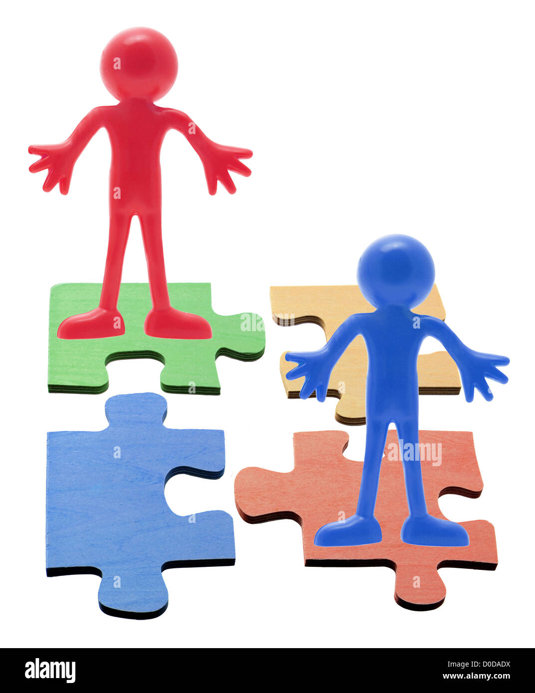 Miniature Figures Standing on Jigsaw Puzzle Pieces Stock Photo - Alamy