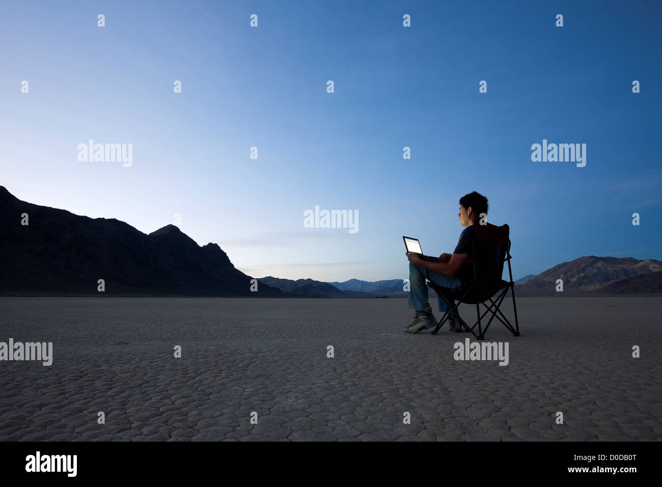 Man working on laptop desert hi-res stock photography and images - Alamy