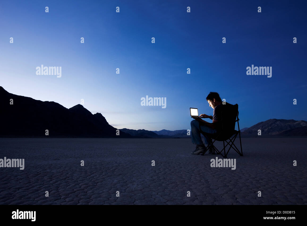Man working on laptop and mountains hi-res stock photography and images ...