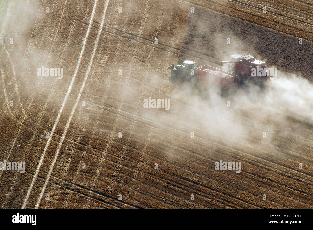 COMBINE HARVESTER IN A WHEAT FIELD ON THE PLAINS OF THE EURE VALLEY ...
