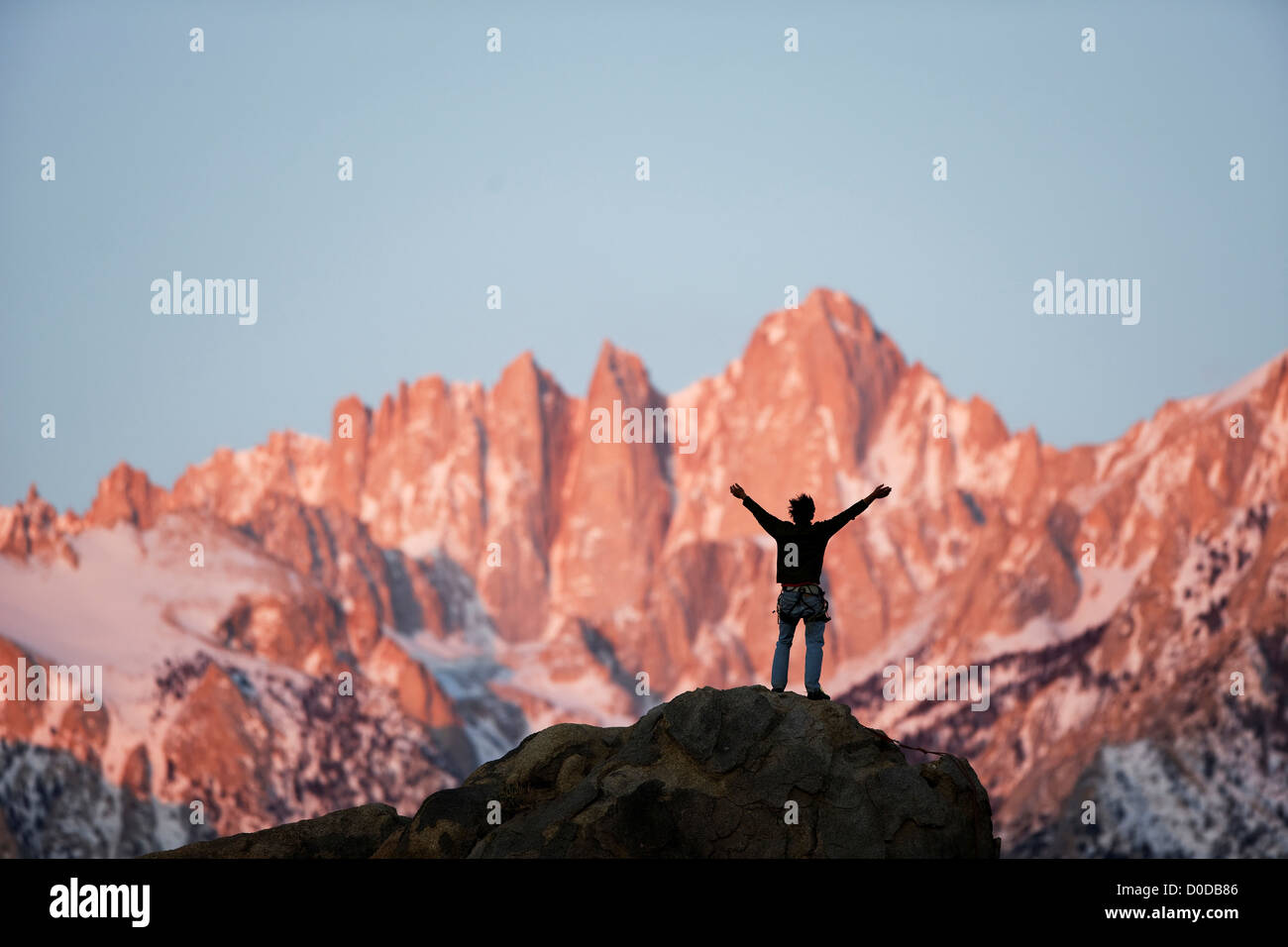 A Climber Atop a Boulder in California's Alabama Hills Enthusiastically ...