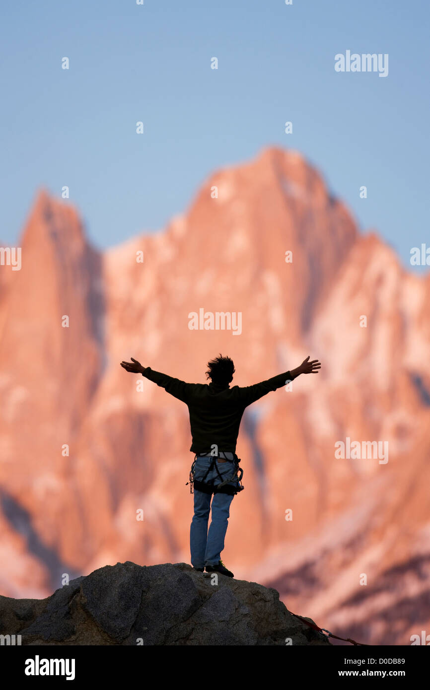 A Climber Enthusiastically Welcomes Dawn New Day Atop Boulder in ...