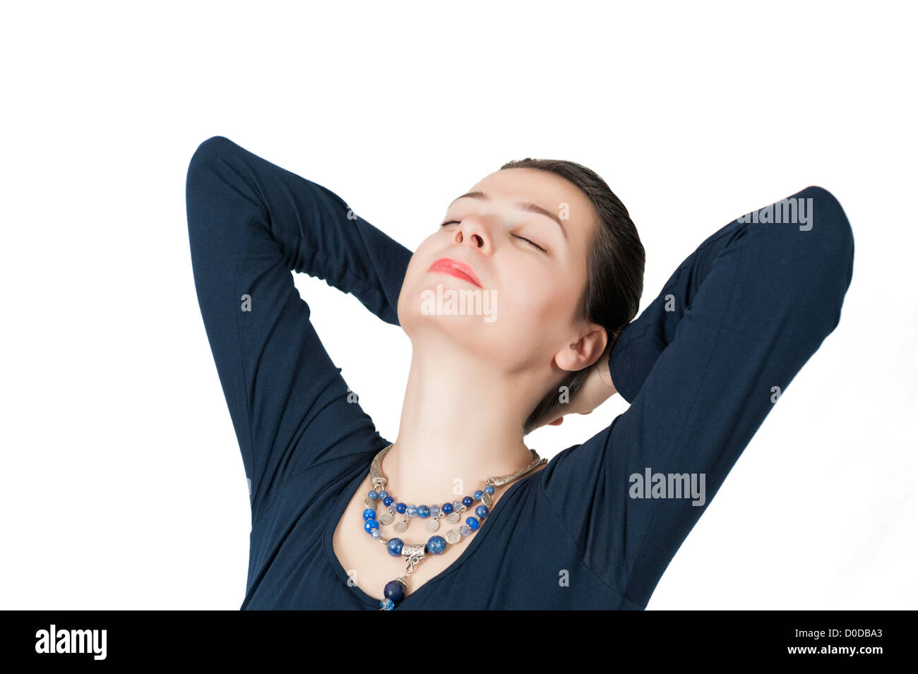 young girl her hand on her back head seems like unwind on white ...