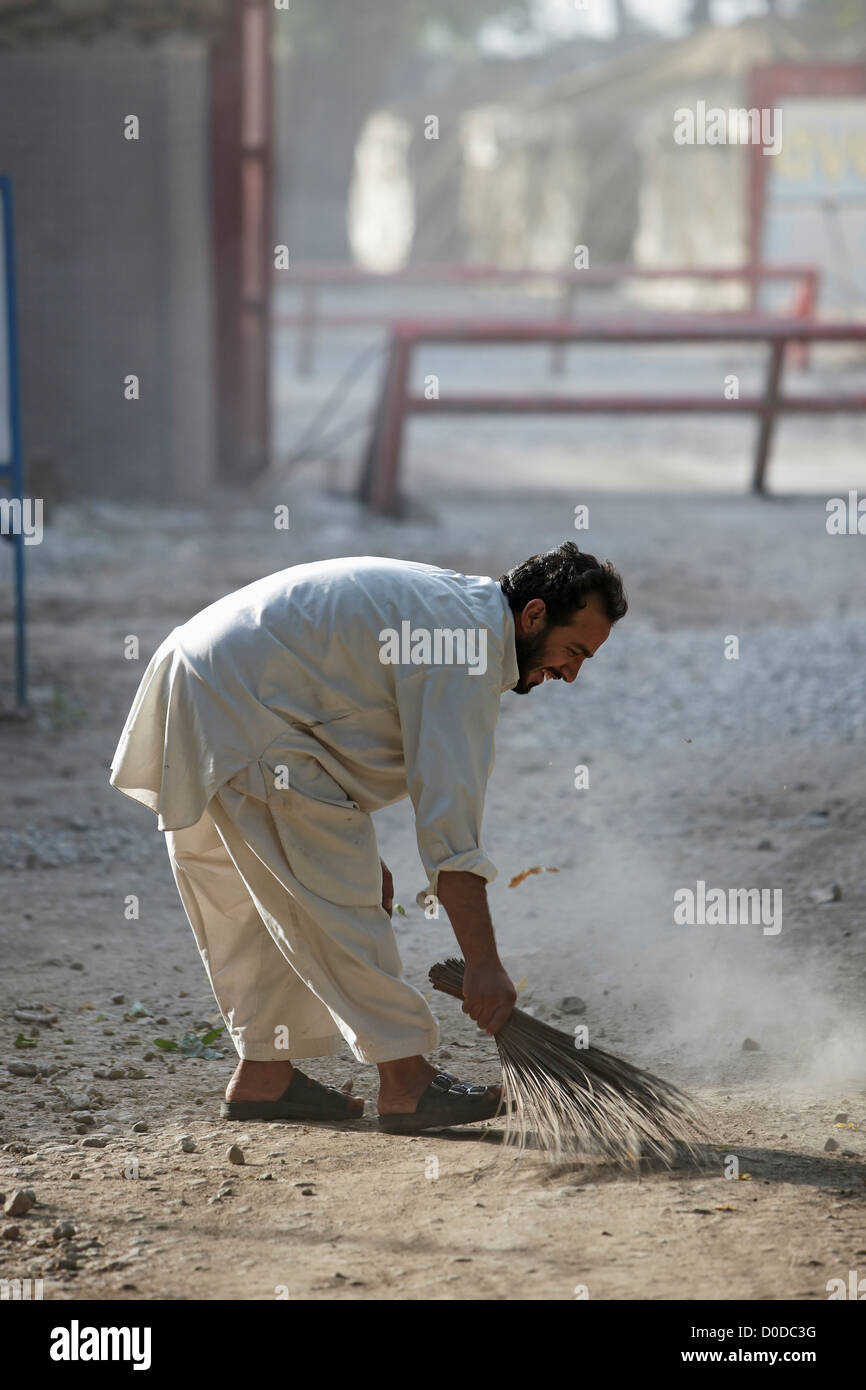 Man sweeping road hi-res stock photography and images - Alamy