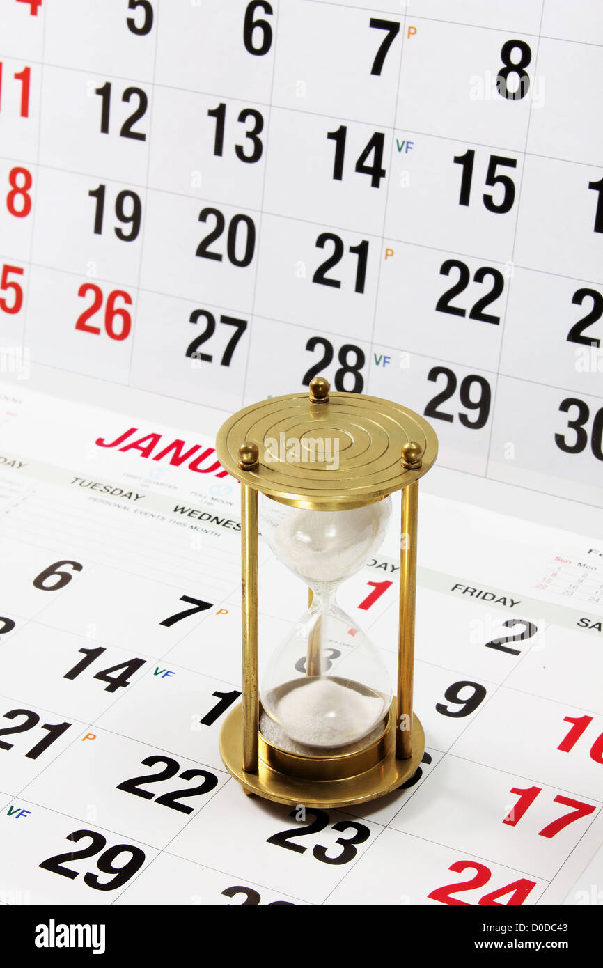 Hourglass on Calendar Stock Photo - Alamy
