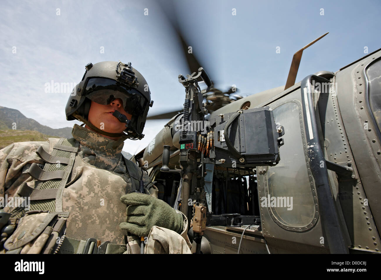U.S. Army Air Crewman And Blackhawk Helicopter at a Base in Afghanistan ...