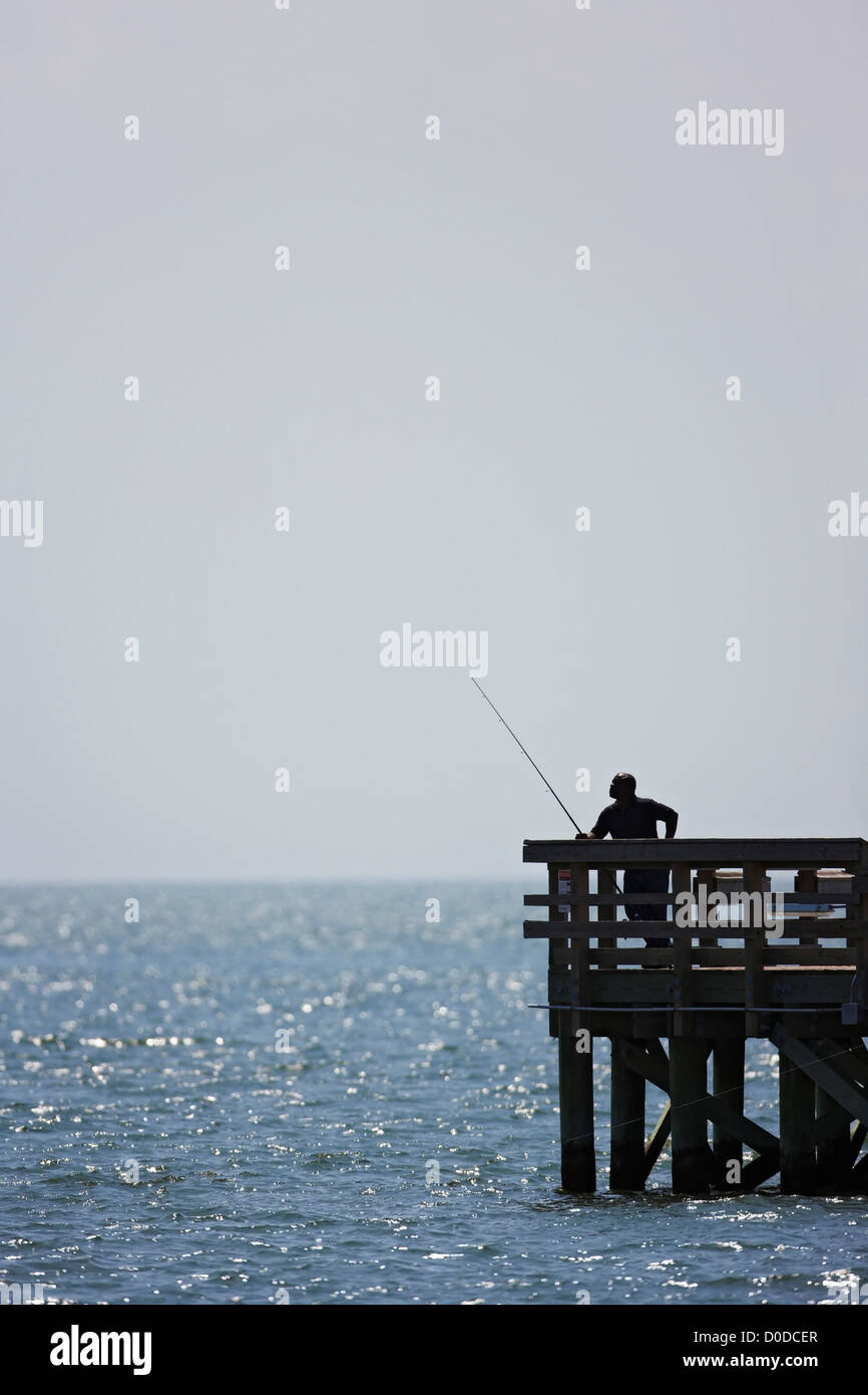 Man Fishing at End of Pier at Cape Charles, Virginia Stock Photo - Alamy