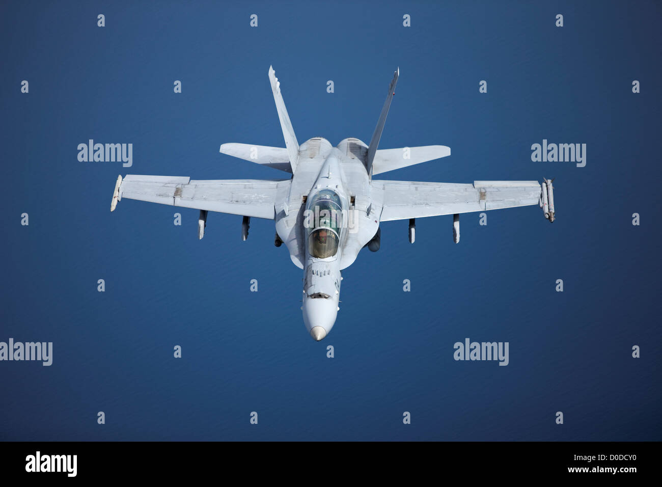 An aerial view of a United States Marine Corps F/A-18D Hornet above the ...