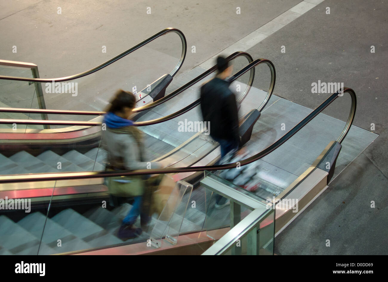 Blurry People On Moving Stairs Stock Photo - Alamy