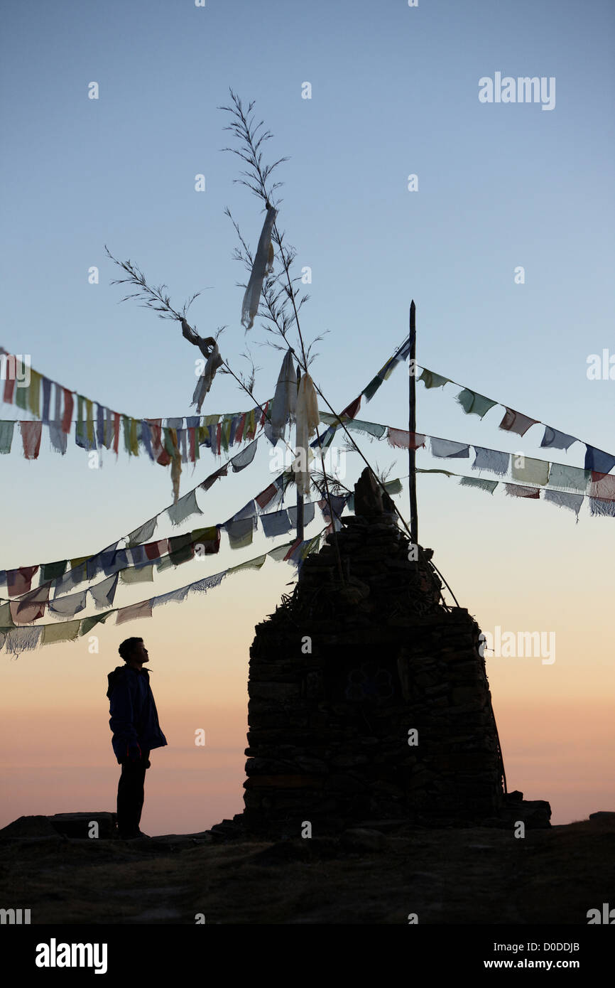 A Nepali man stands at a Buddhist shrine at Khongma La, in eastern ...