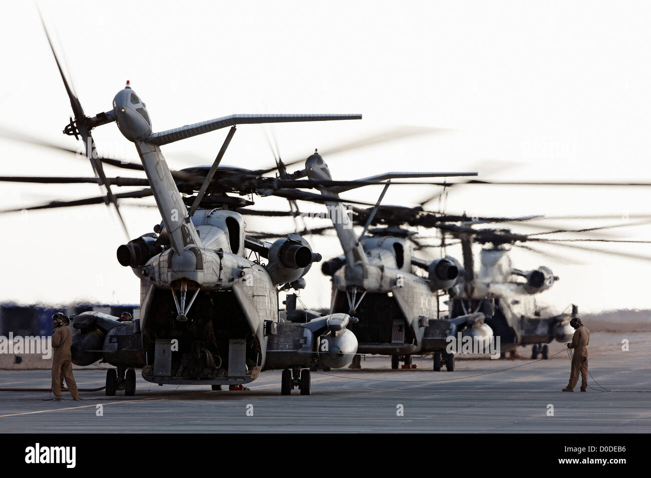 U.S. Marine Corps CH-53E Super Stallions in a line awaiting refueling ...
