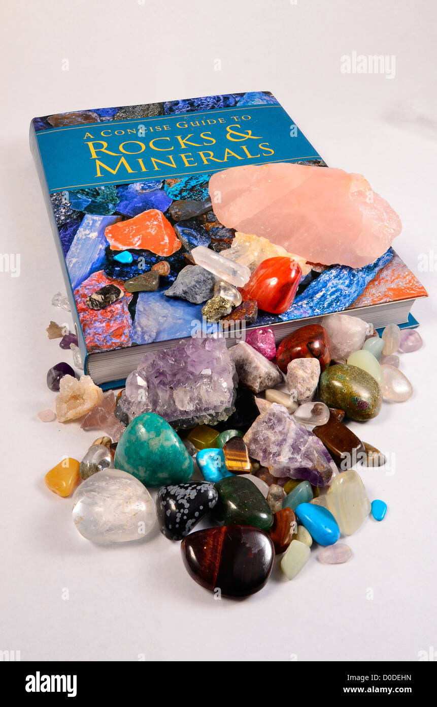 Rocks & Minerals with guide book Stock Photo - Alamy