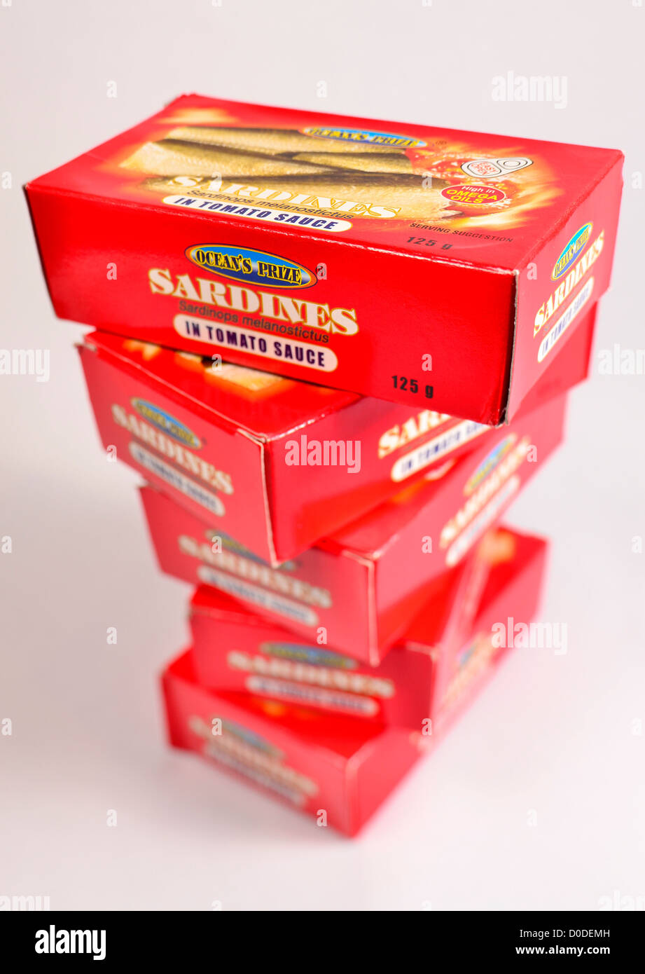 Sardine Tins in boxes stacked Stock Photo - Alamy