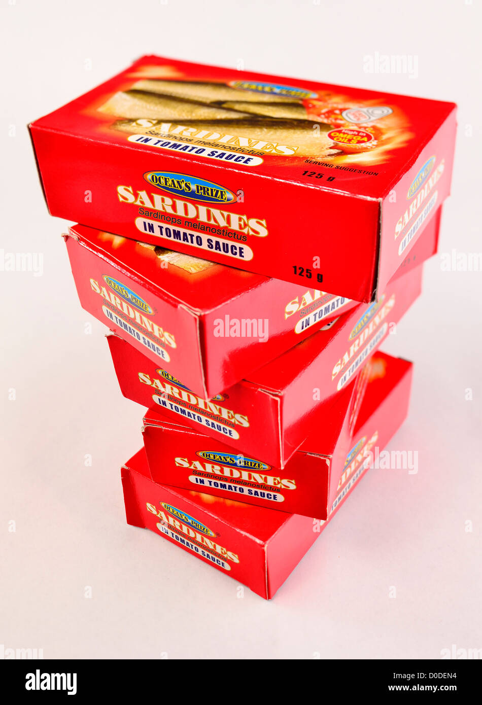 Sardine Tins in boxes stacked Stock Photo - Alamy