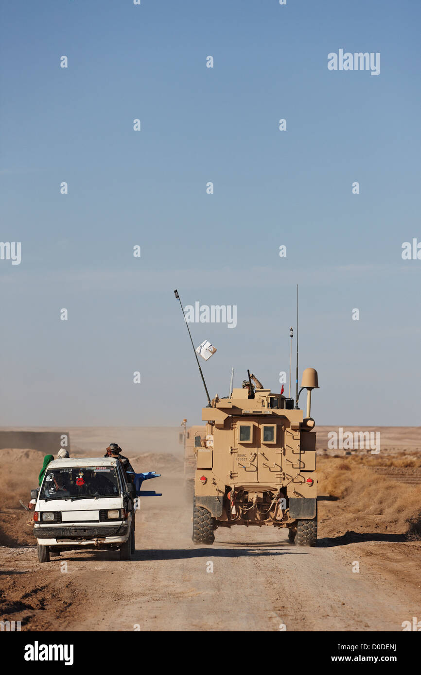 A U.S. Marine MRAP or Mine Resistant Ambush Protected vehicle passes ...