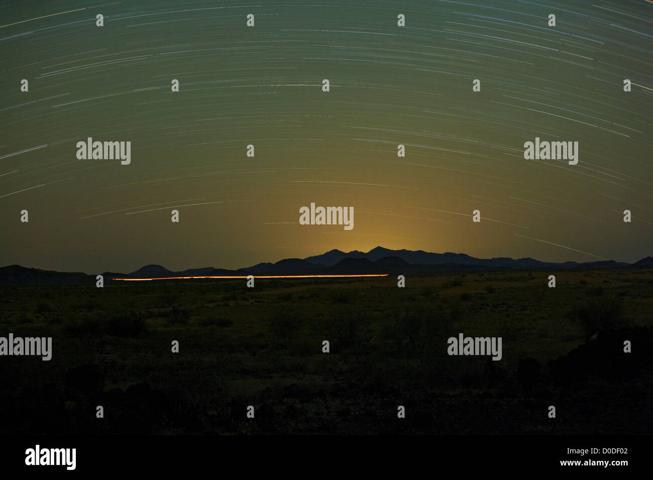 The Pinacate Peaks are visible here under arching star trails, with ...