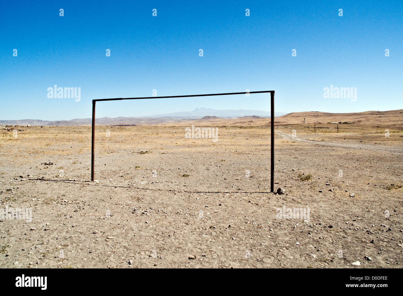 Goal posts in a makeshift football or soccer pitch in a rural area near ...