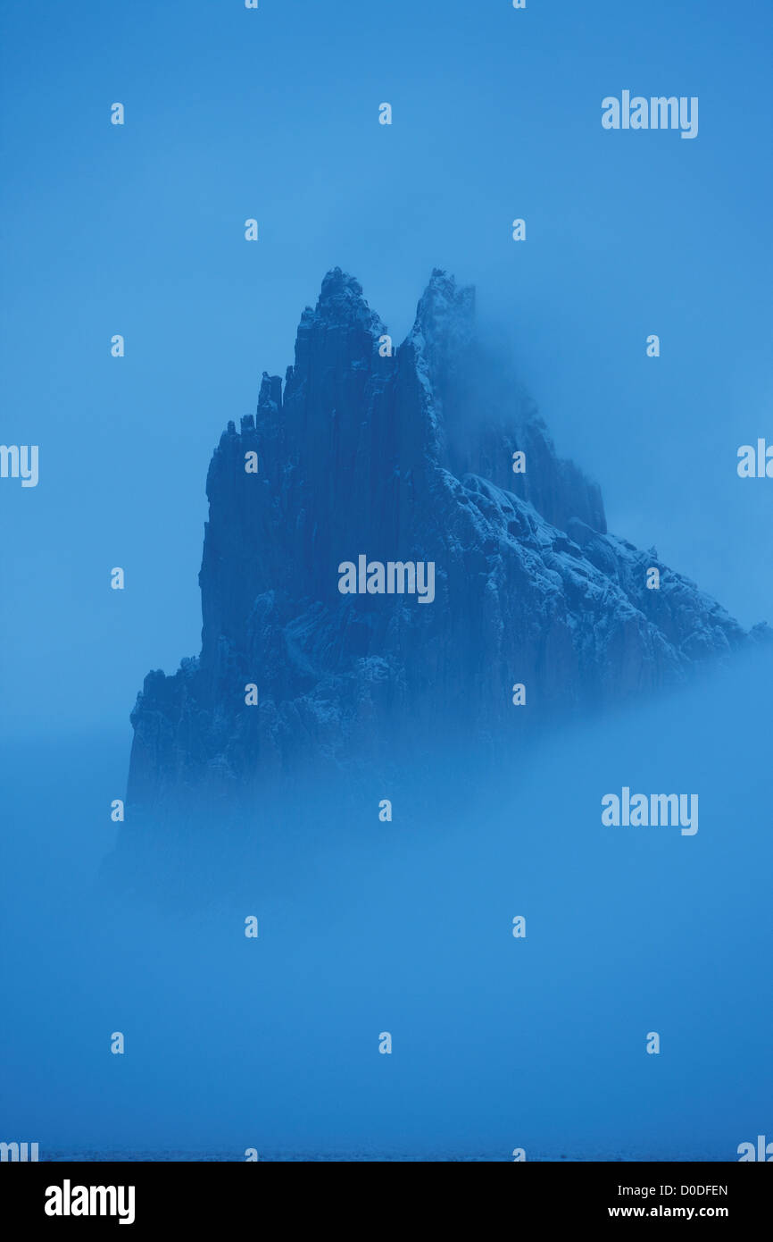 Winter fog shrouds Shiprock, also called Ship Rock, an ancient volcanic ...
