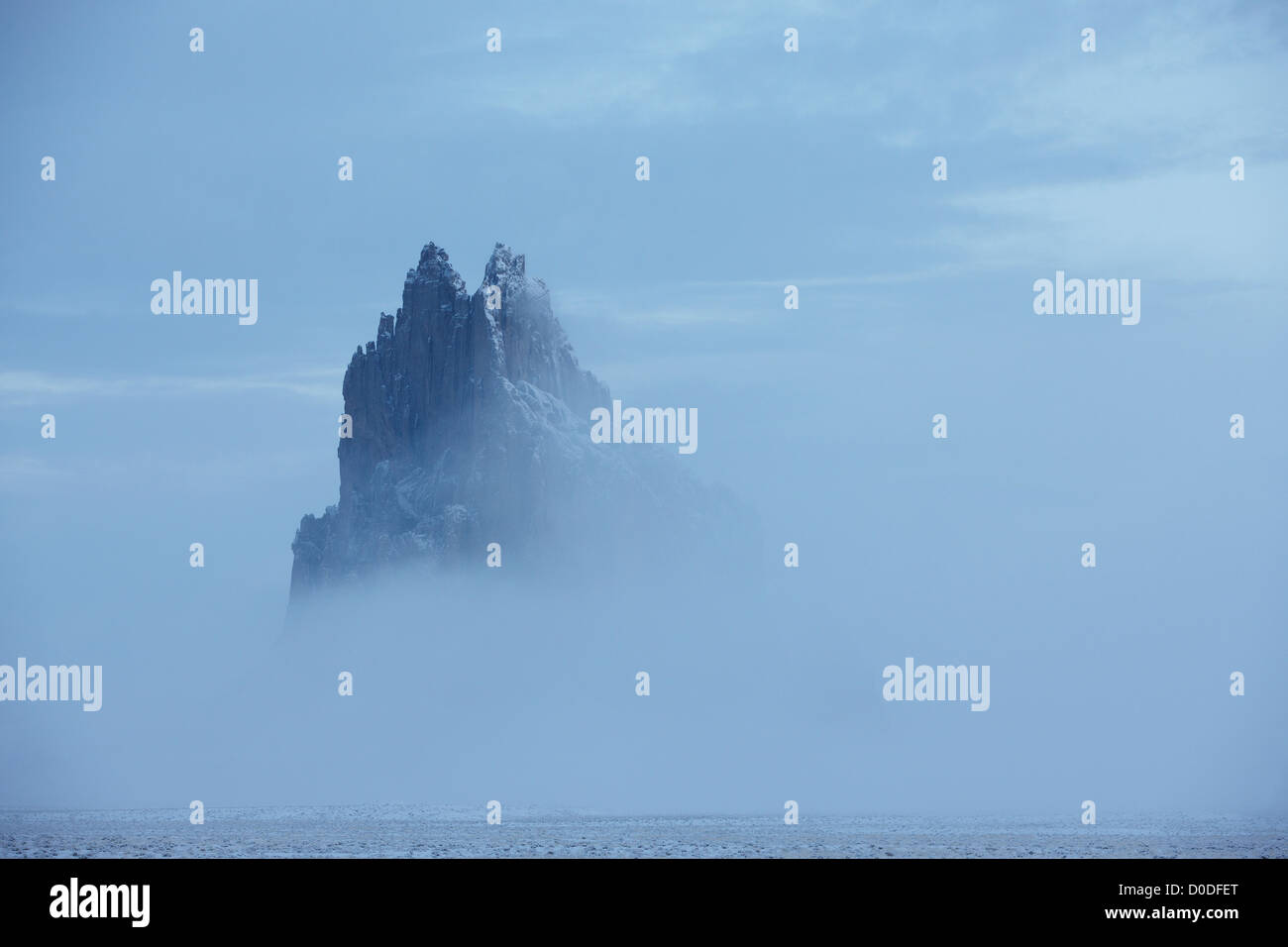 Winter fog shrouds Shiprock, also called Ship Rock, an ancient volcanic ...